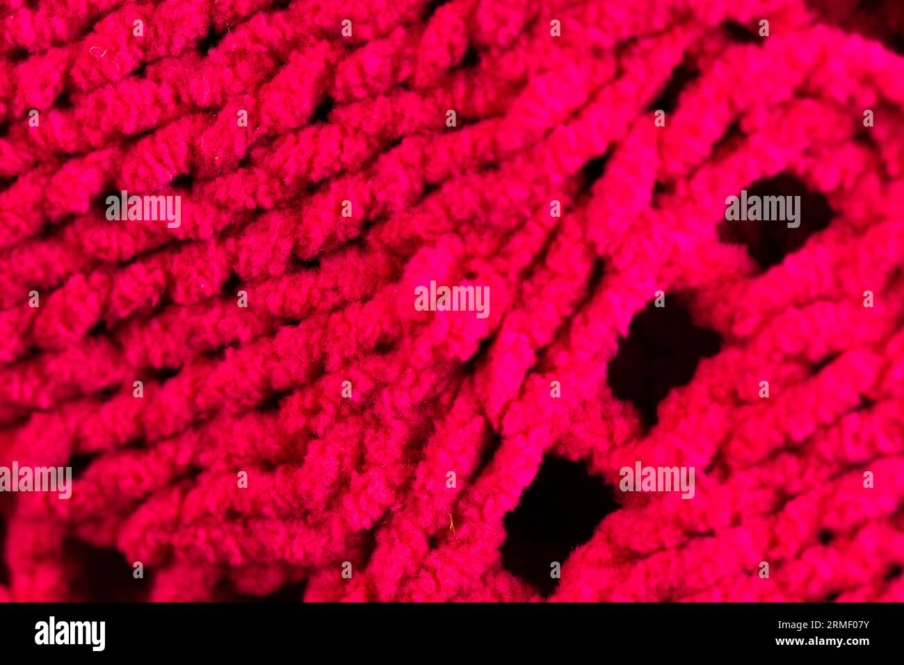 Micro close up of pink wooly crochet fabric with copy space Stock Photo ...
