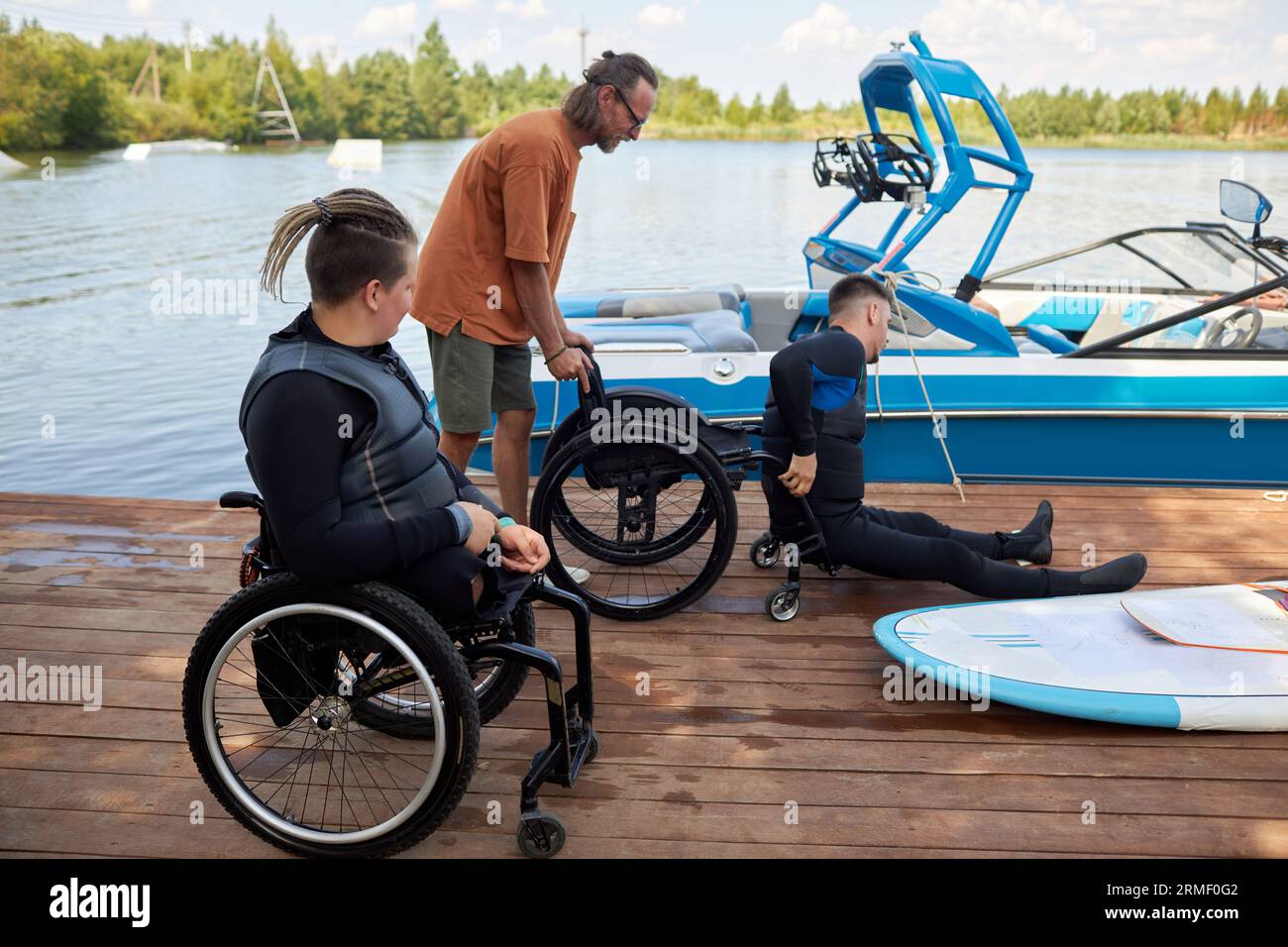 Side view portrait of two people with disability using adaptive sports ...