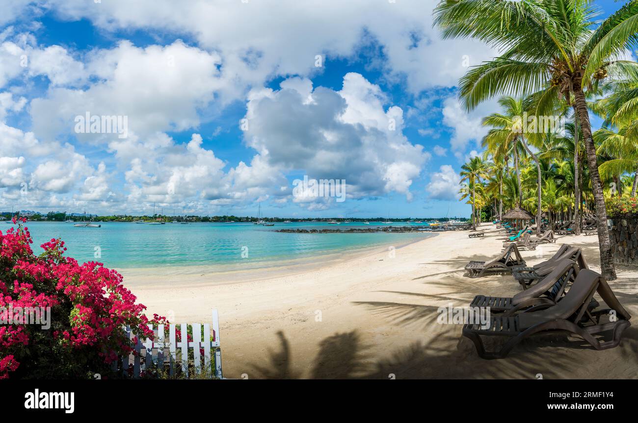 Landscape with public beach at Grand baie village on Mauritius island ...