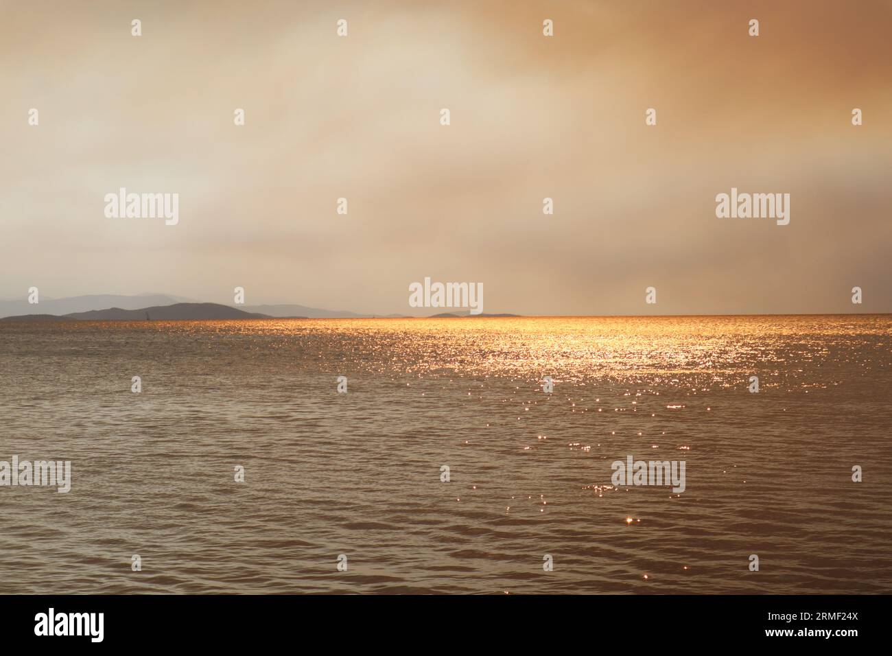 Smoke and Fires in Greek Islands summer from sea Stock Photo - Alamy