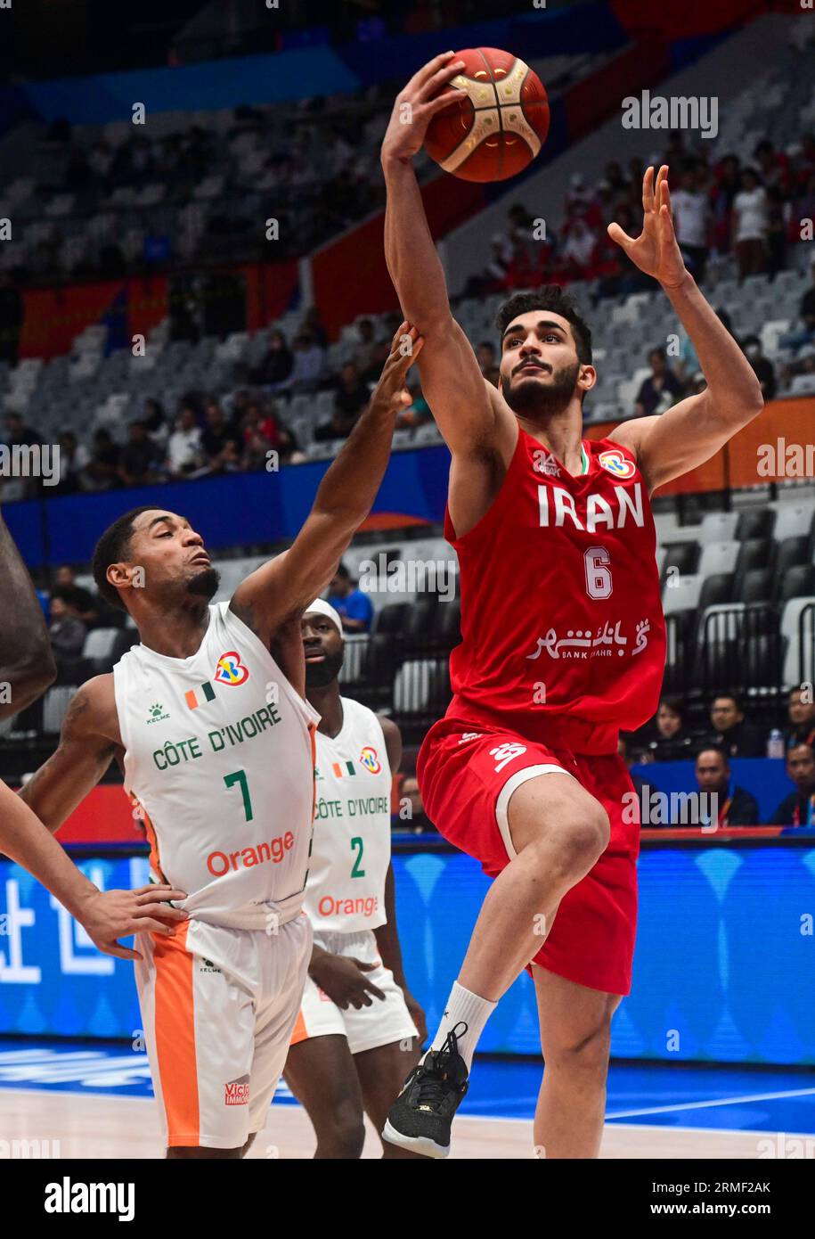 JAKARTA, Aug. 28, 2023 (Xinhua) -- Mohammad Amini (R) of Iran goes up for a lay-up during during ...