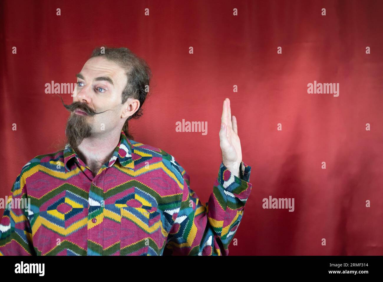 Hipster man moving head and saying No or Stop to his left side with ...