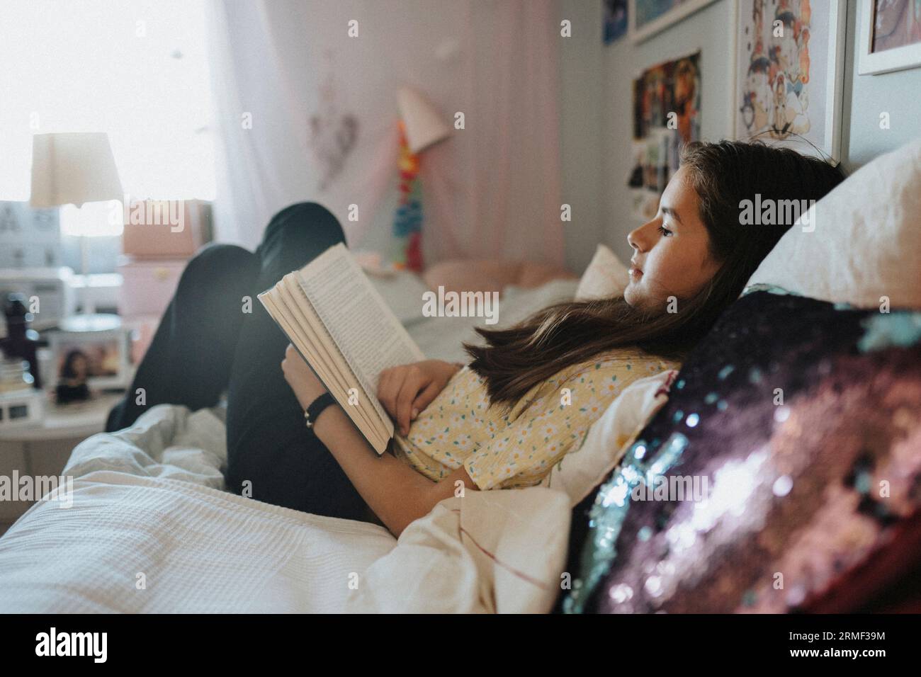 Girl relaxing reading book in hi-res stock photography and images - Alamy