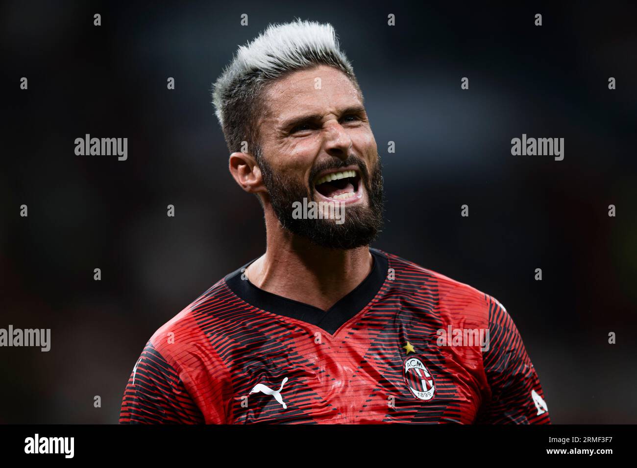 Olivier Giroud of AC Milan celebrates after scoring a goal from a ...