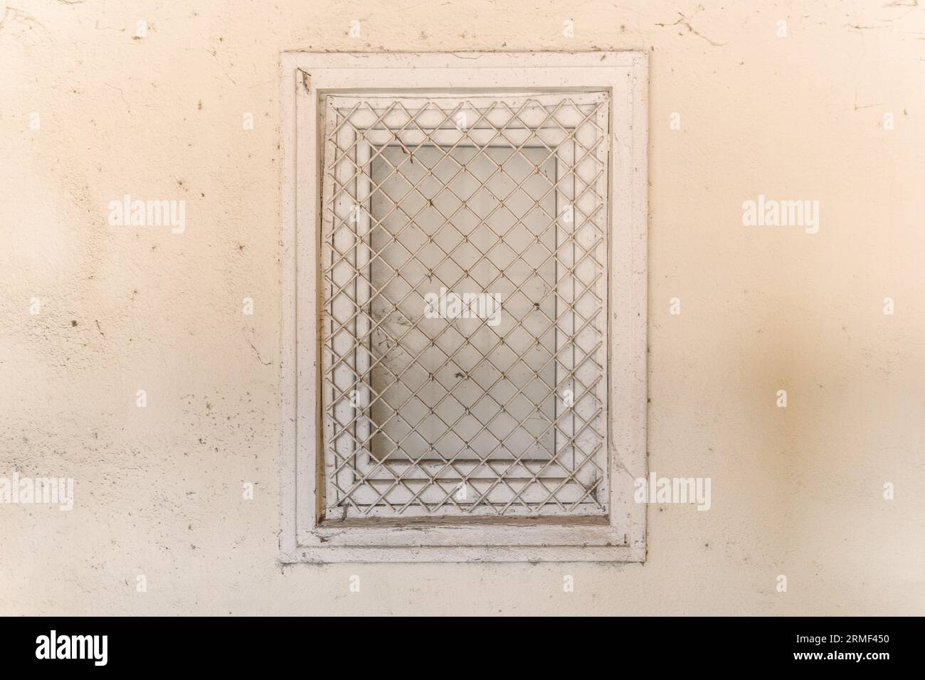 Old window with bars on the wall of a rural house Stock Photo - Alamy