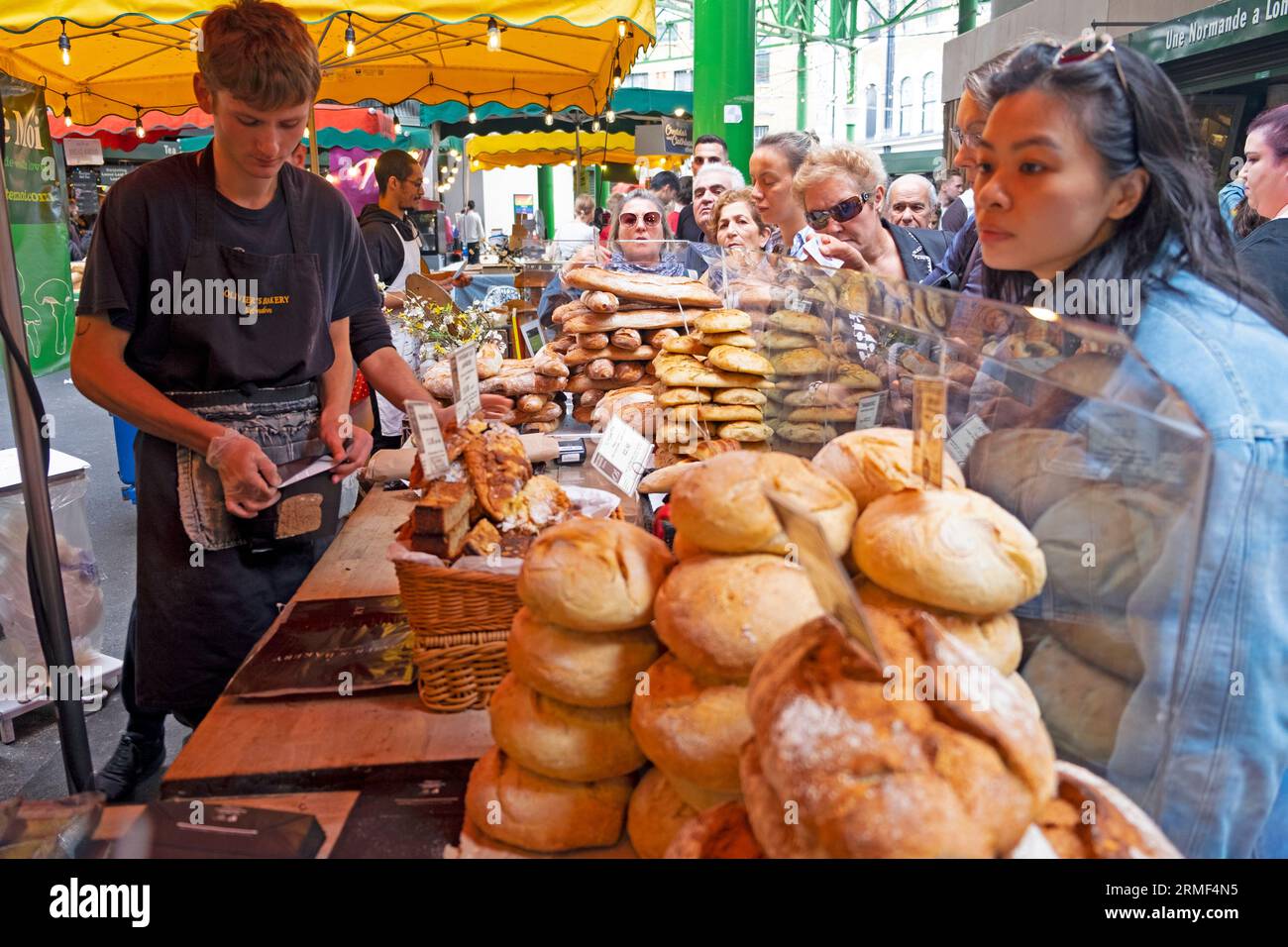 People buying loaves of bread, cakes, pastry, pastries from market ...