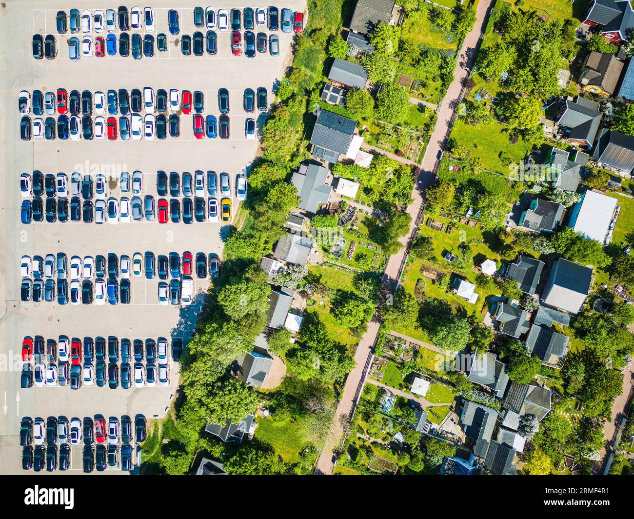 Aerial view of cars parked at parking and houses with gardens Stock ...
