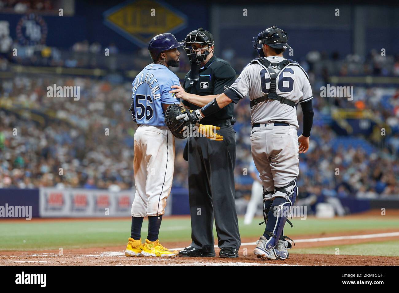 St. Petersburg, FL USA; Home plate umpire Adam Beck (38) speaks with ...