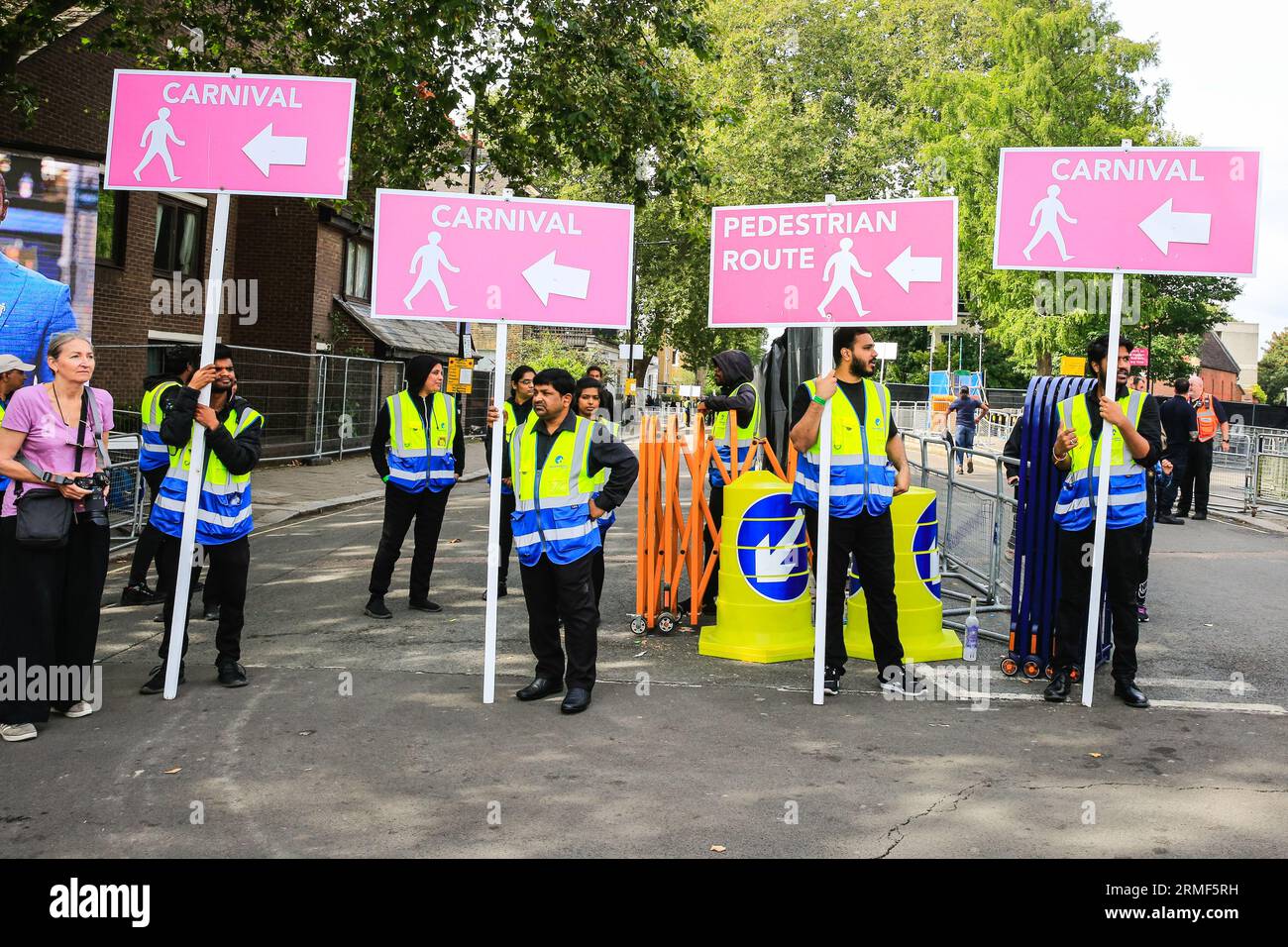London, UK. 28th Aug, 2023. Stewards with signs showing directions to ...