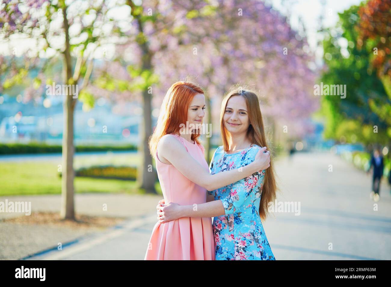Two beautiful girls together in Paris on a spring day Stock Photo - Alamy