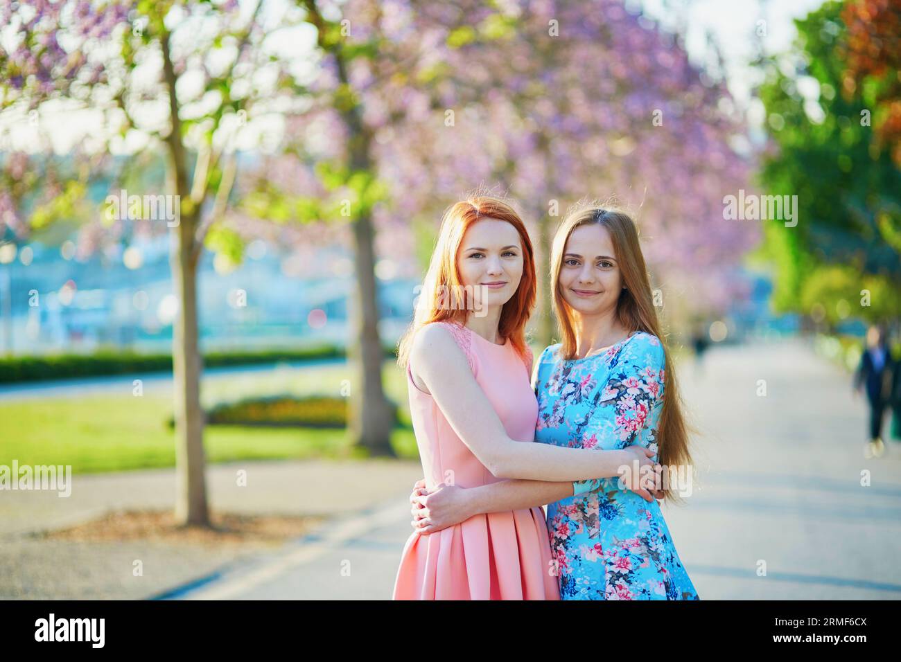 Two beautiful girls together in Paris on a spring day Stock Photo - Alamy