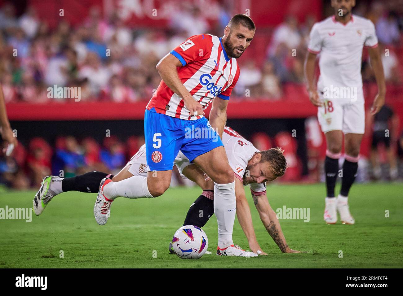 Seville, Spain. 26th, August 2023. David Lopez (5) of Girona and Ivan ...