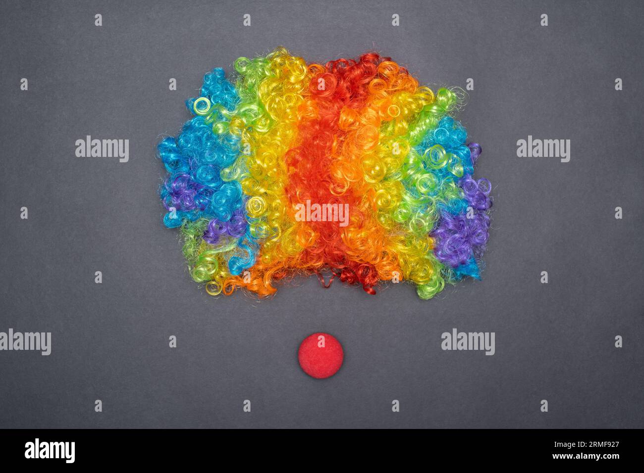 Funny Party concept clown face formed. Wig with Red clown nose like a ...