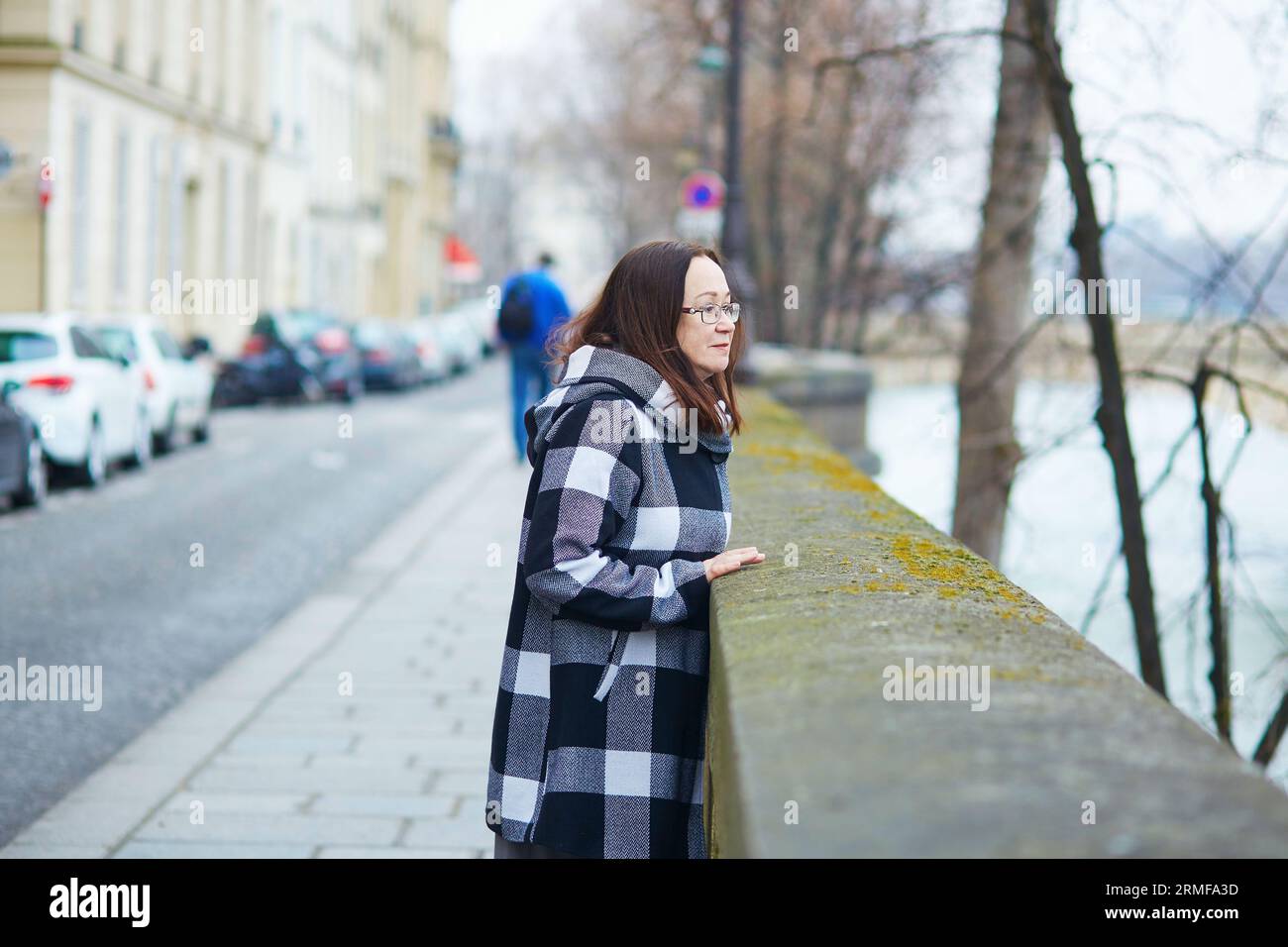 Middle aged woman walking in Paris, France Stock Photo - Alamy