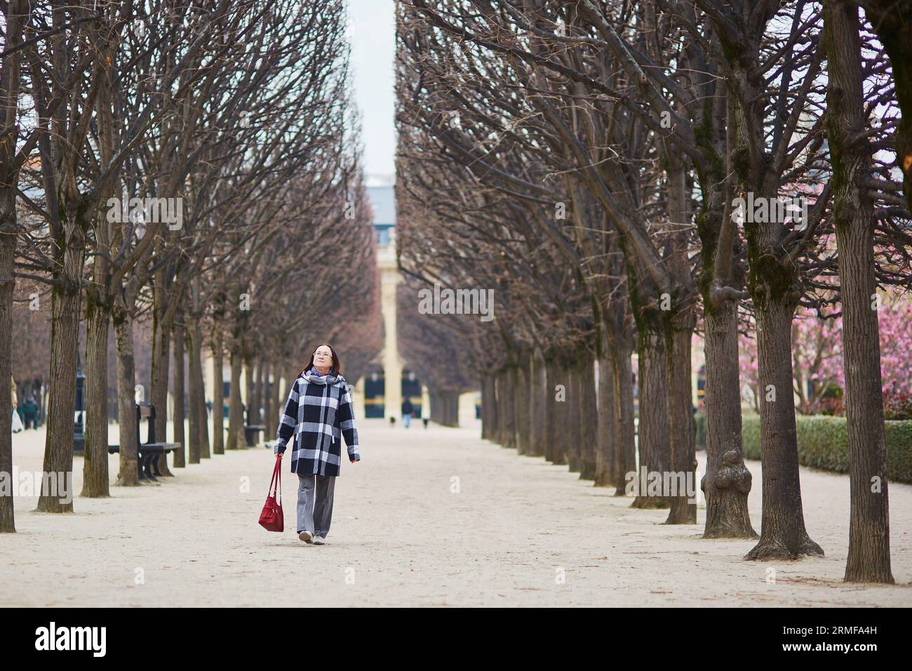 Middle aged woman walking in Paris, France Stock Photo - Alamy
