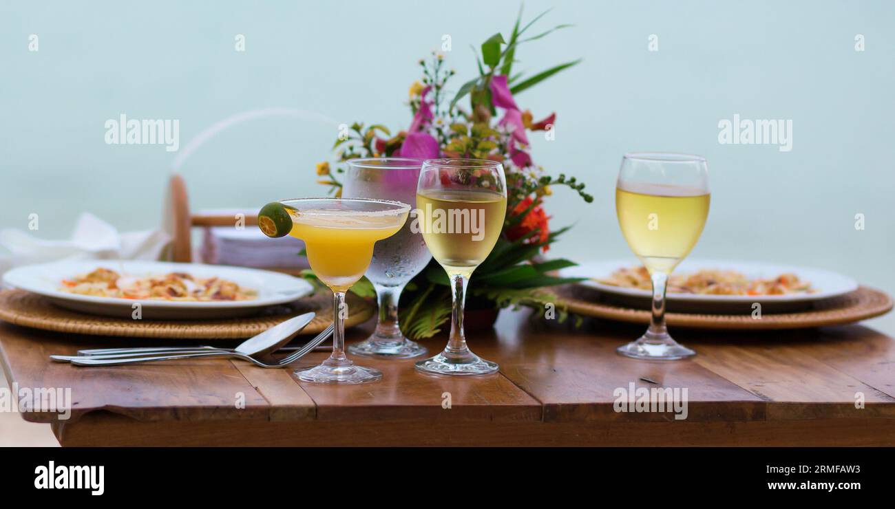 Romantic dinner for two with margarita cocktail served on a beach Stock ...