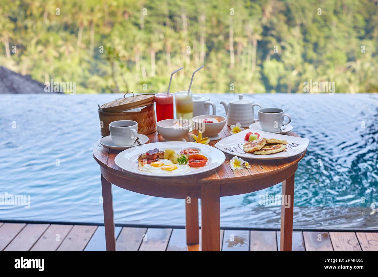Traditional Balinese breakfast with banana pancake and fresh fruits ...