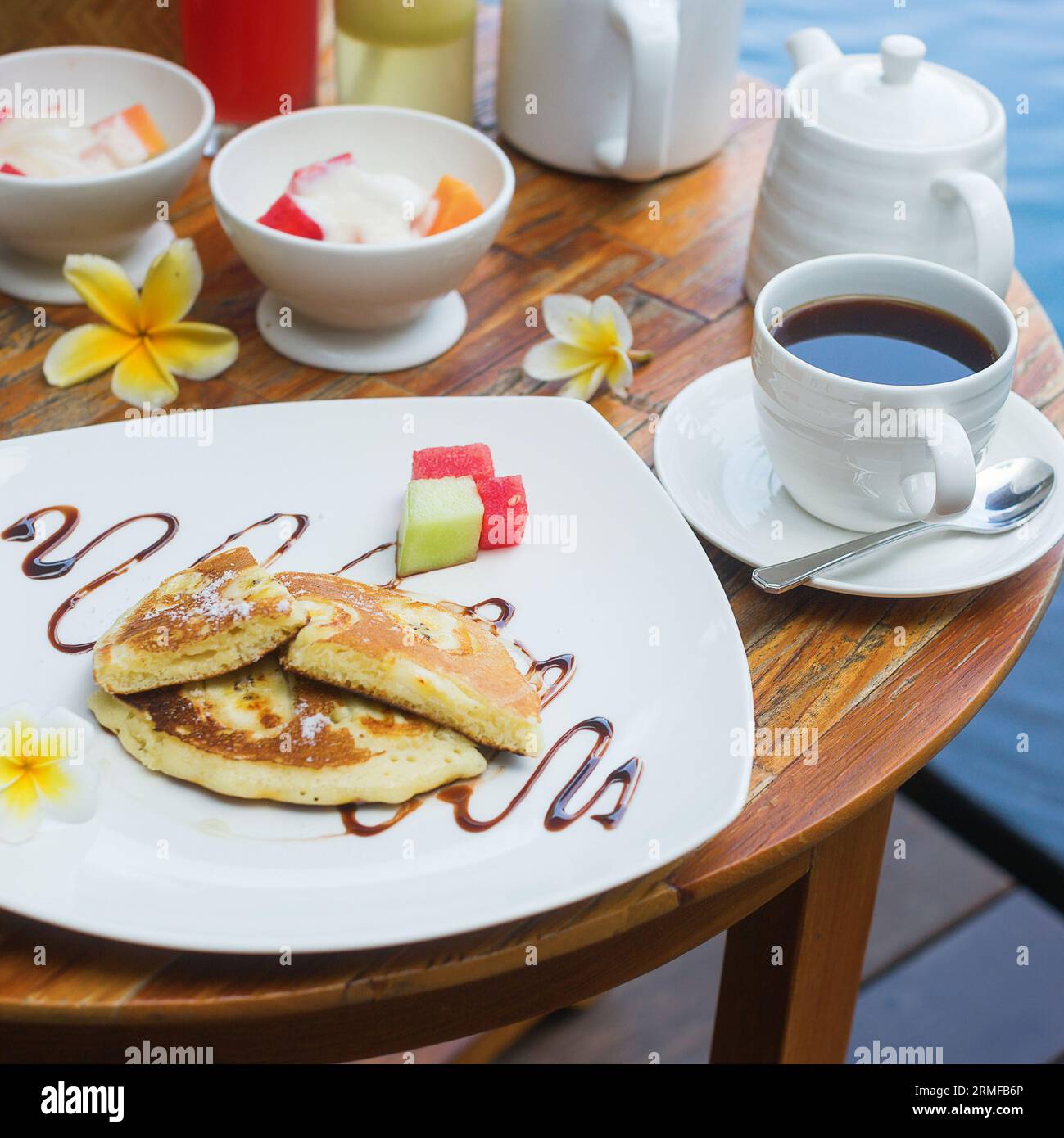 Traditional Balinese banana pancake and fresh fruits Stock Photo - Alamy