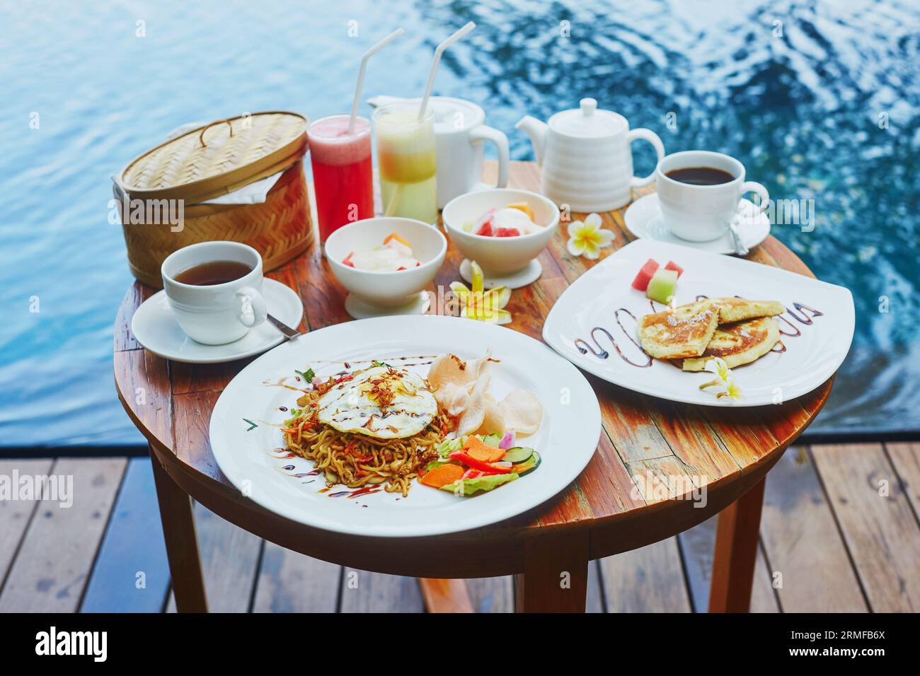 Traditional Balinese breakfast with fried noodles (mie goreng), banana ...