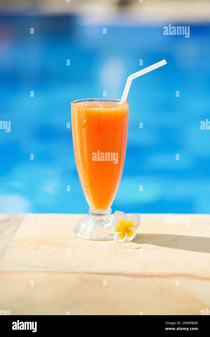 Delicious fresh mango juice near the pool on a tropical resort Stock ...