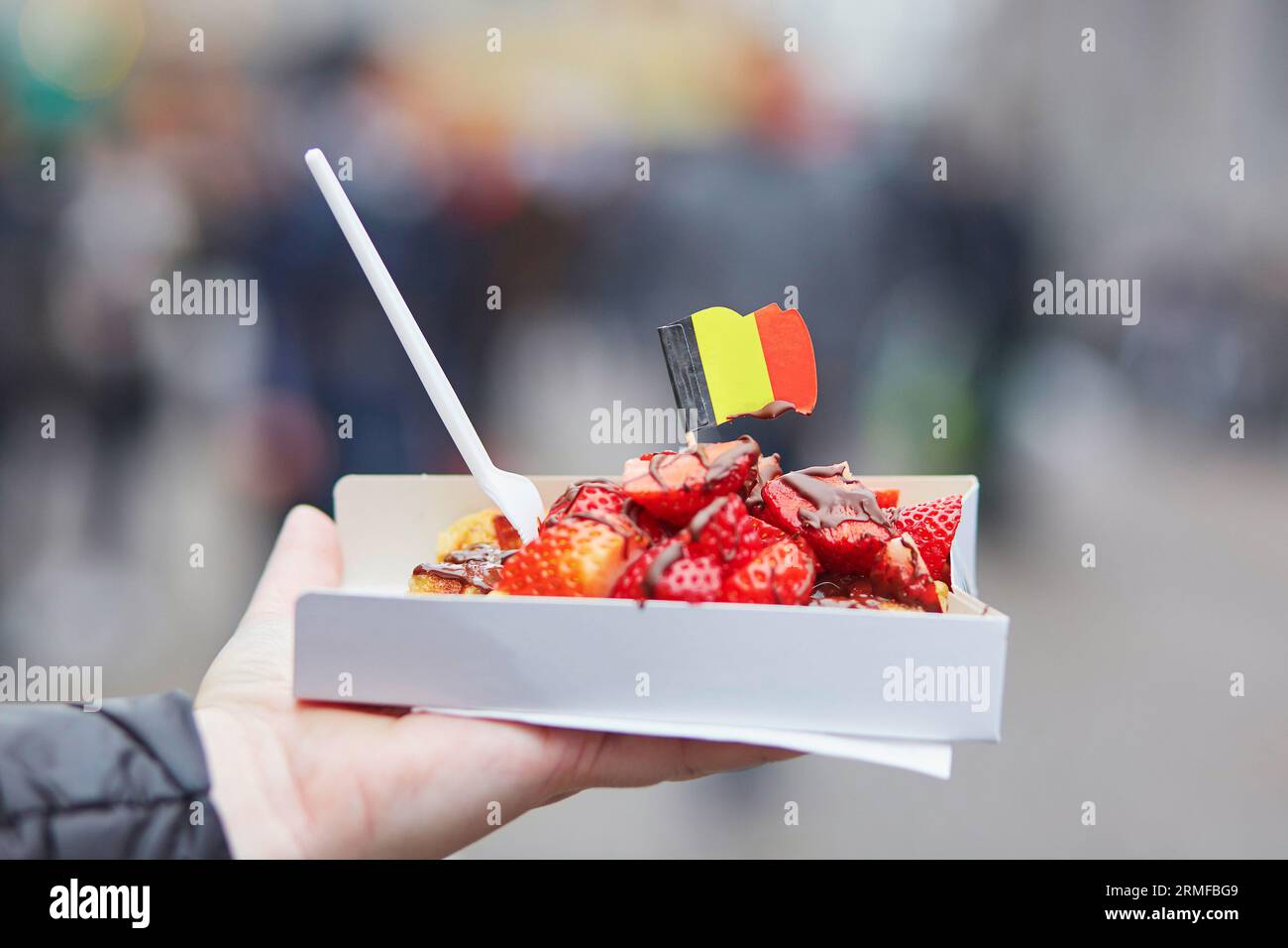 Typical belgian waffle in the street, ready to eat Stock Photo - Alamy