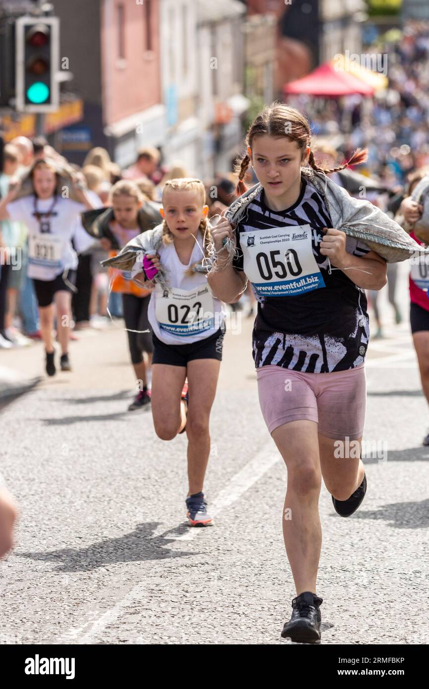 Girls taking part in the Scottish Coal Carrying Championships through ...