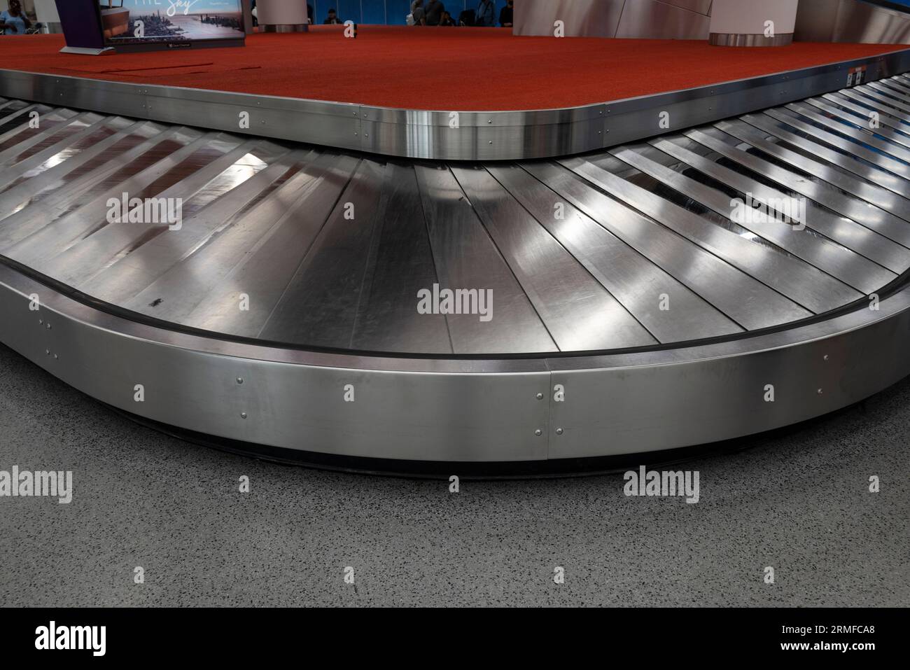 An empty baggage conveyor belt at a non-busy airport Stock Photo - Alamy