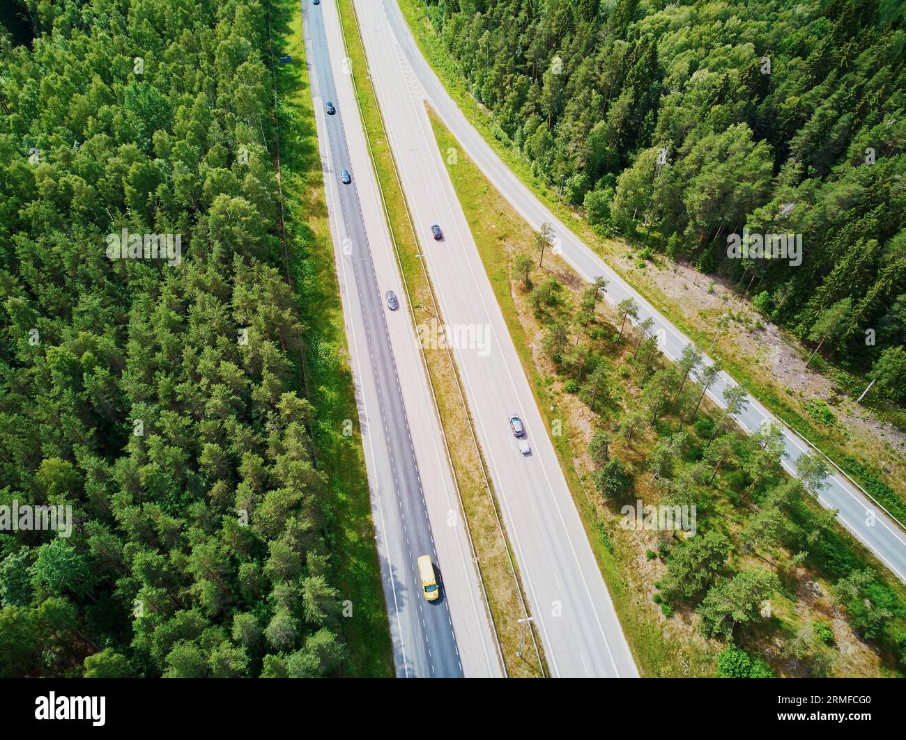 Aerial view of road interchange surrounded by forest in the countryside ...