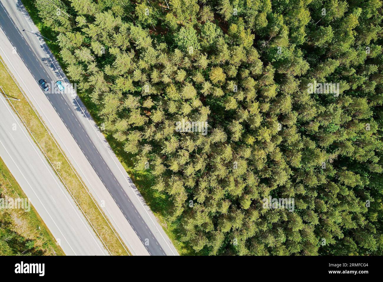 Aerial view of road interchange surrounded by forest in the countryside ...
