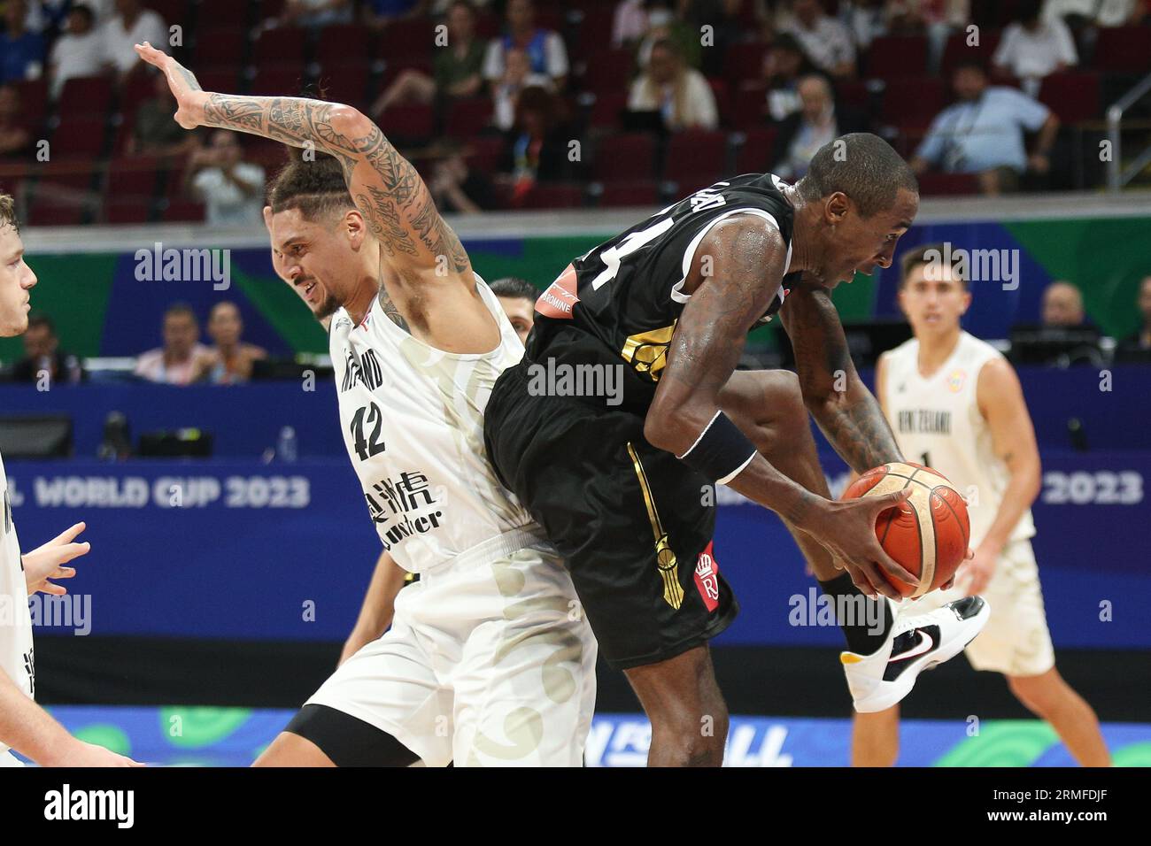 Rondae Hollis-Jefferson (24, Black) secures the rebound over Isaac Fotu ...