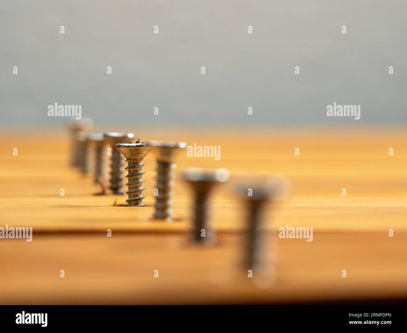 Nail the screws into the board hi-res stock photography and images - Alamy