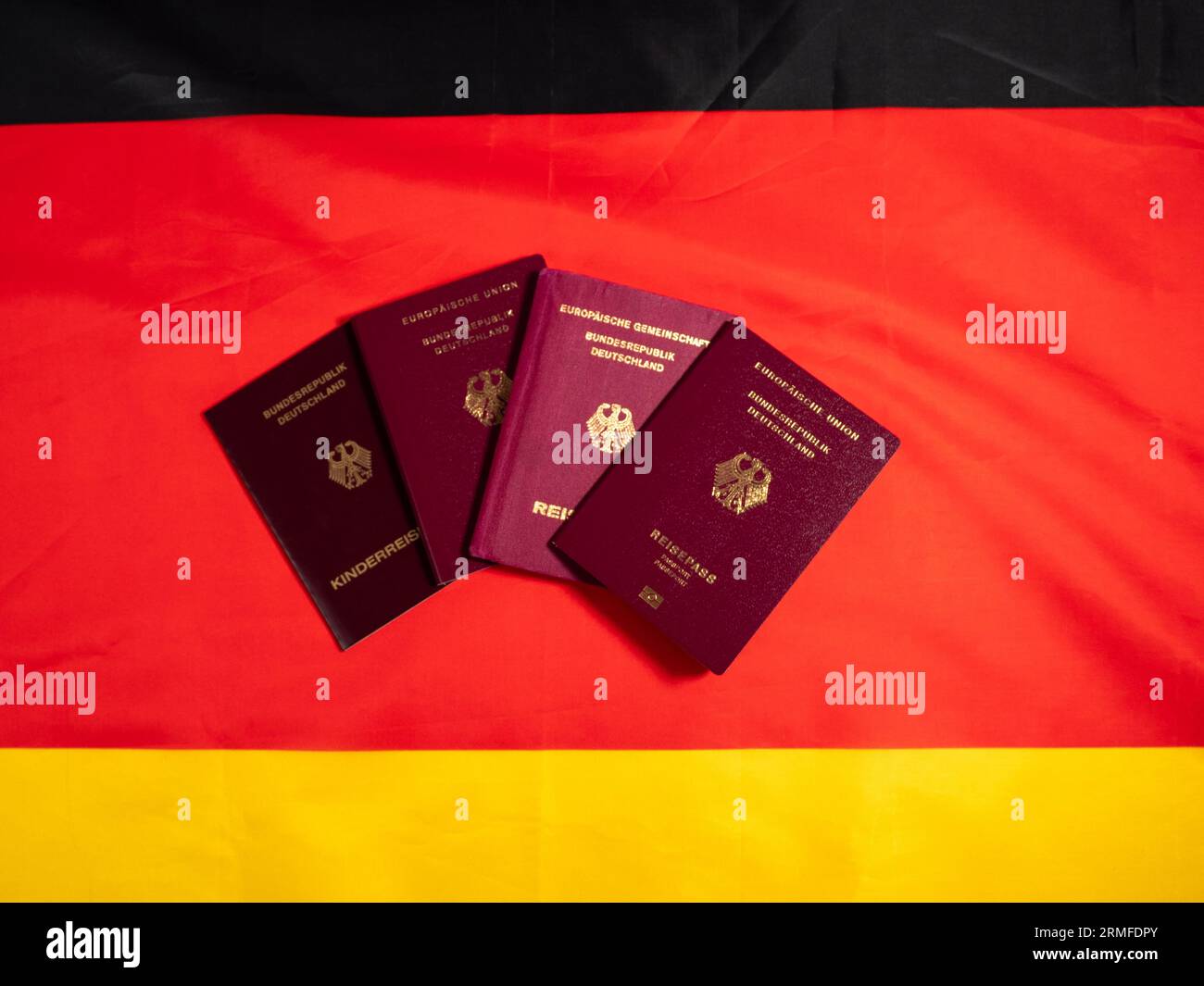 Passport of a citizen of Germany on the background of the flag of ...