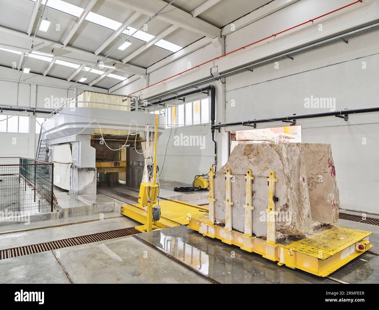 man in stone cutting factory/workshop. stone mine. marble mine ...
