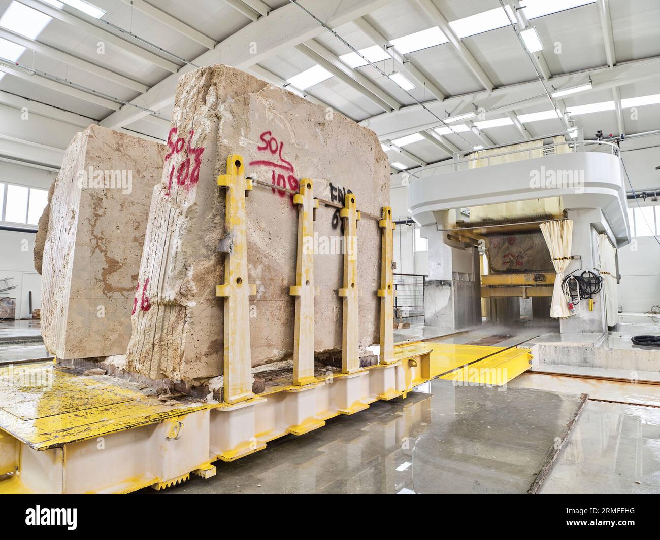 man in stone cutting factory/workshop. stone mine. marble mine ...