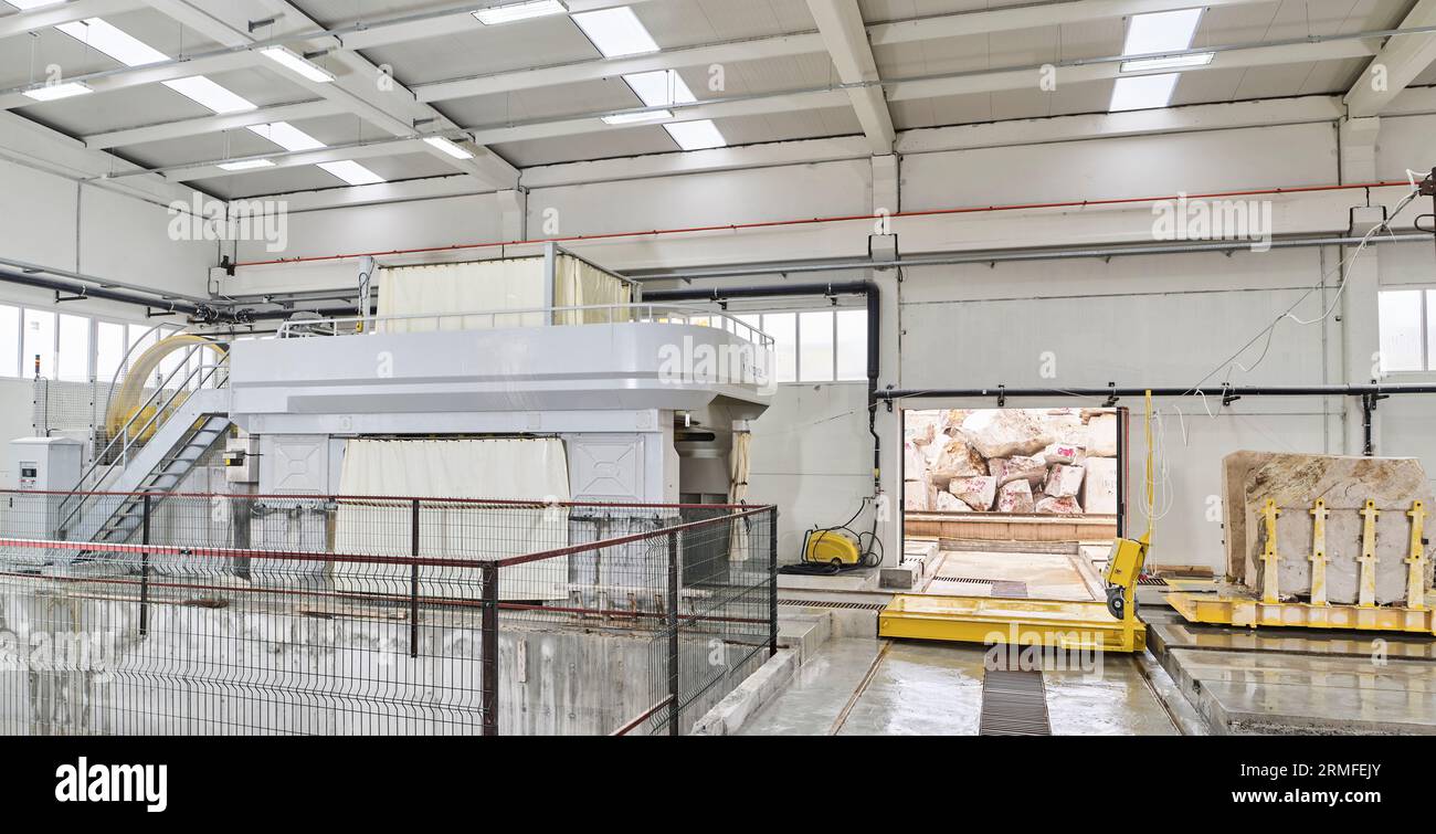 man in stone cutting factory/workshop. stone mine. marble mine ...