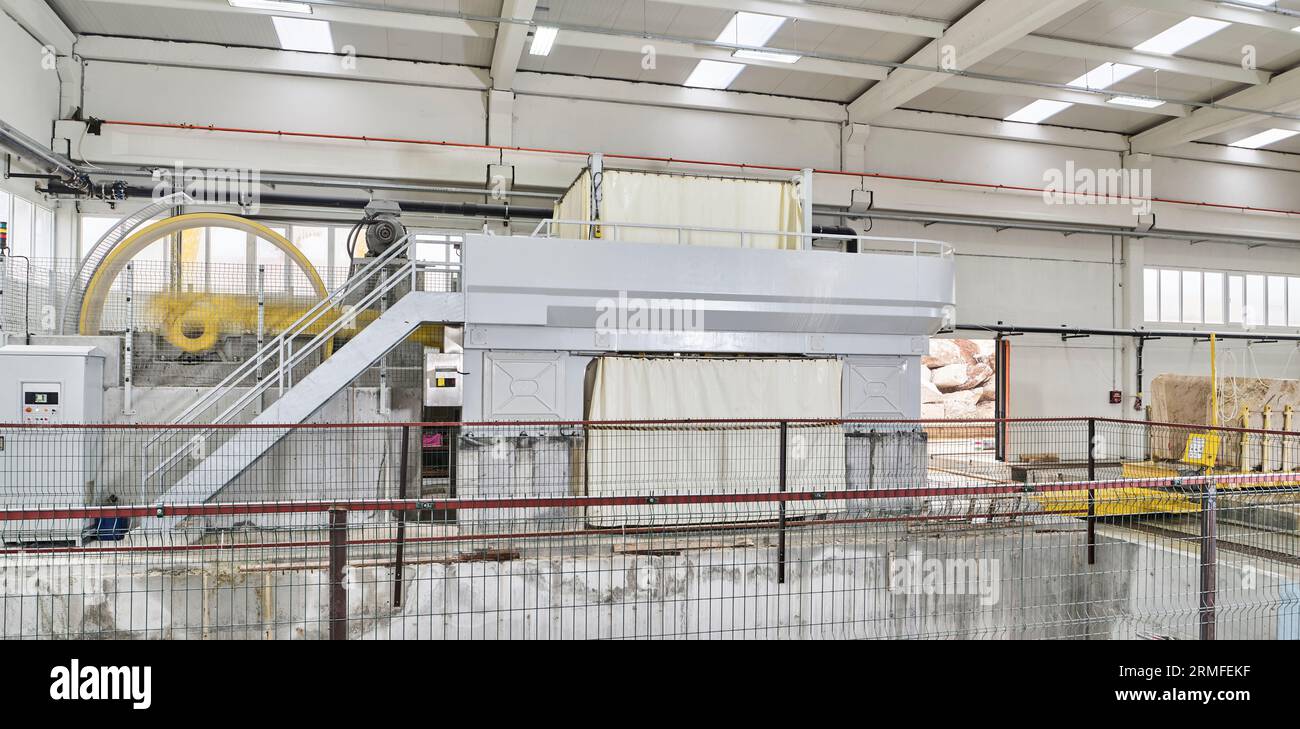 man in stone cutting factory/workshop. stone mine. marble mine ...