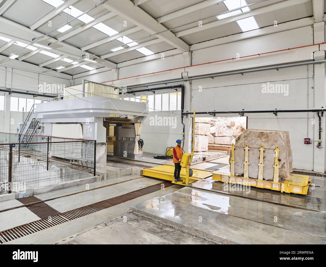 man in stone cutting factory/workshop. stone mine. marble mine ...