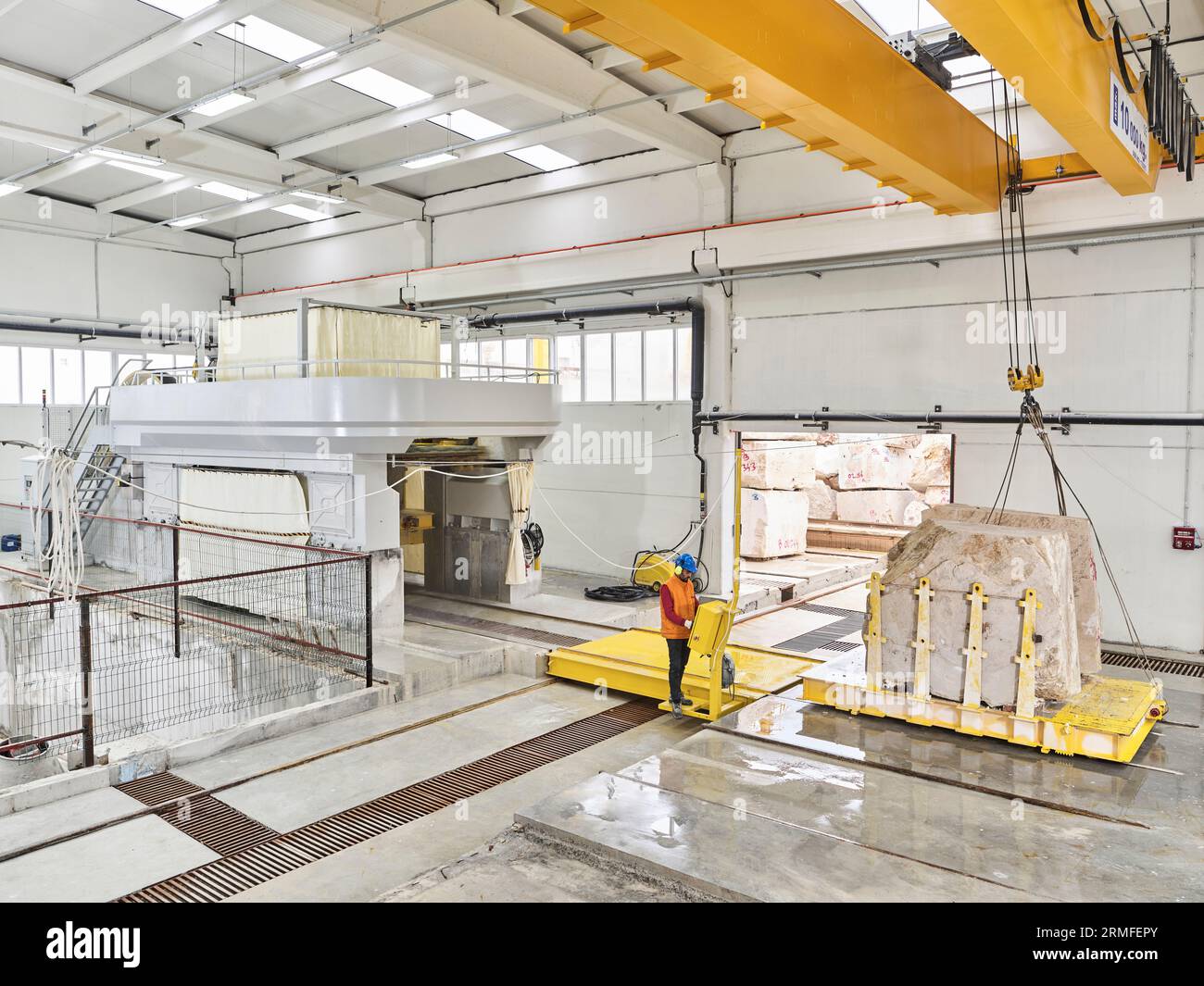 man in stone cutting factory/workshop. stone mine. marble mine ...