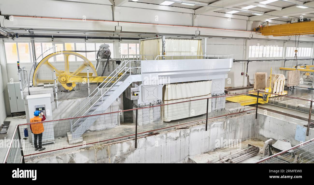 man in stone cutting factory/workshop. stone mine. marble mine ...