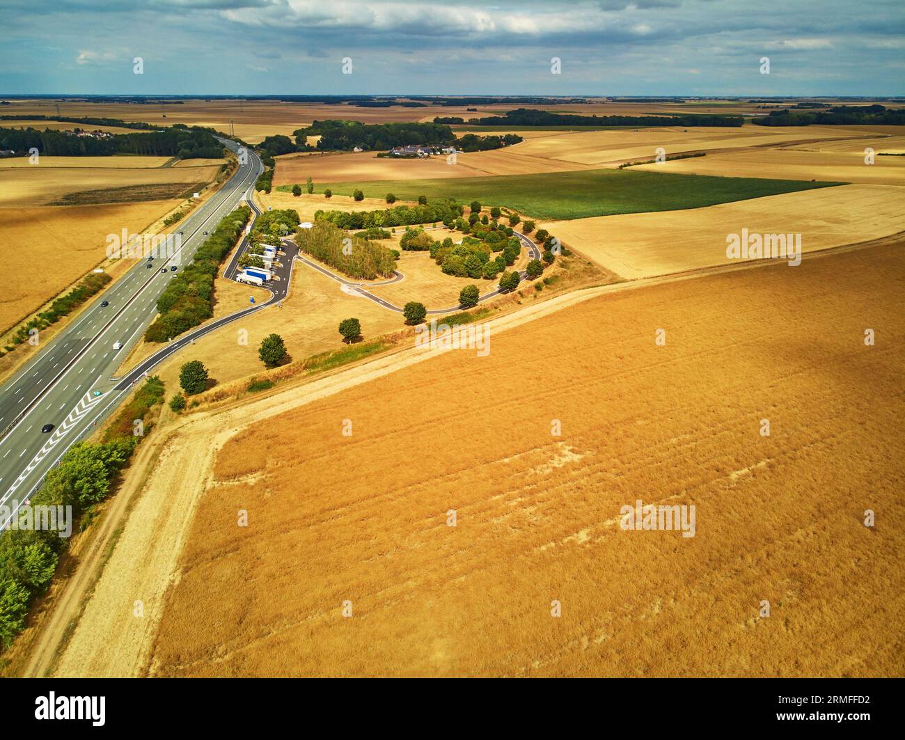 Aerial drone view of beautiful French countryside and six-lane motorway ...