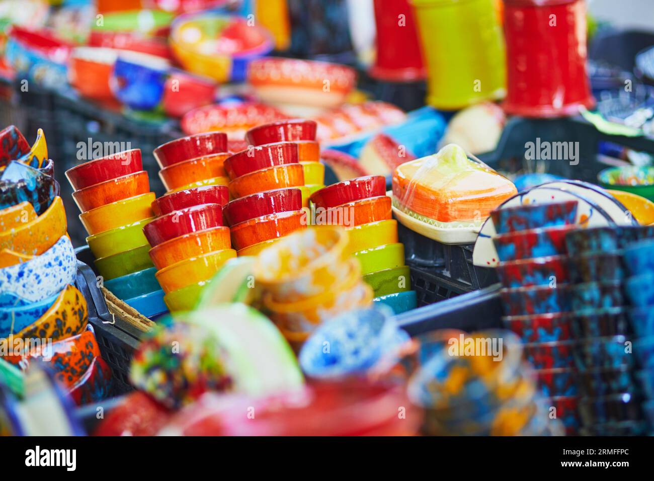 Colorful clay crockery on a farmer market in Cucuron, Provence, France ...