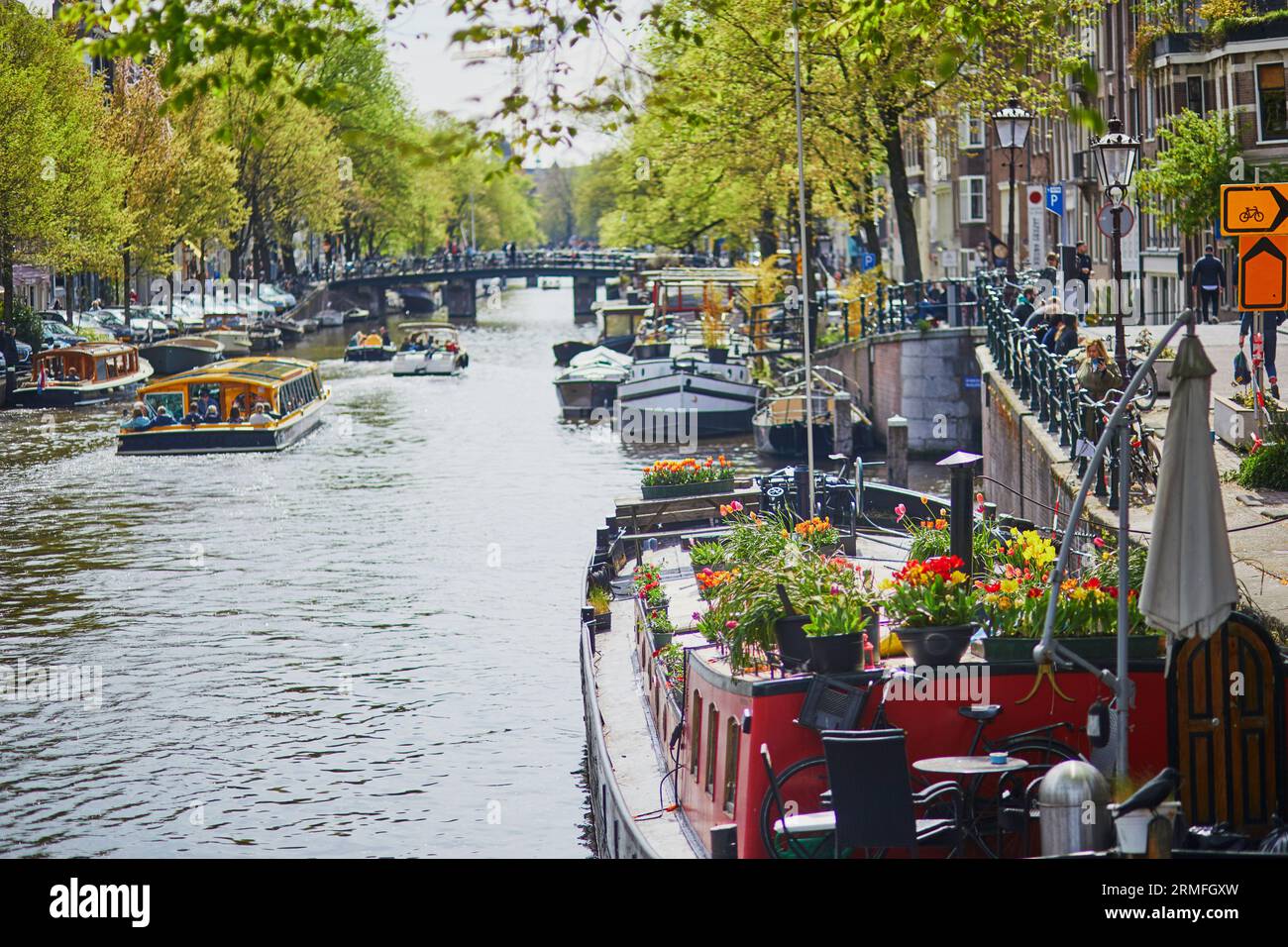 Scenic view of Amsterdam, the Netherlands with its canals, embankments ...