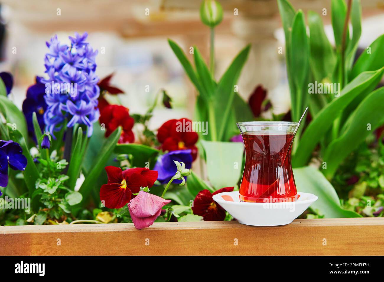 Turkish black tea in traditional glass of tulip form with flower ...