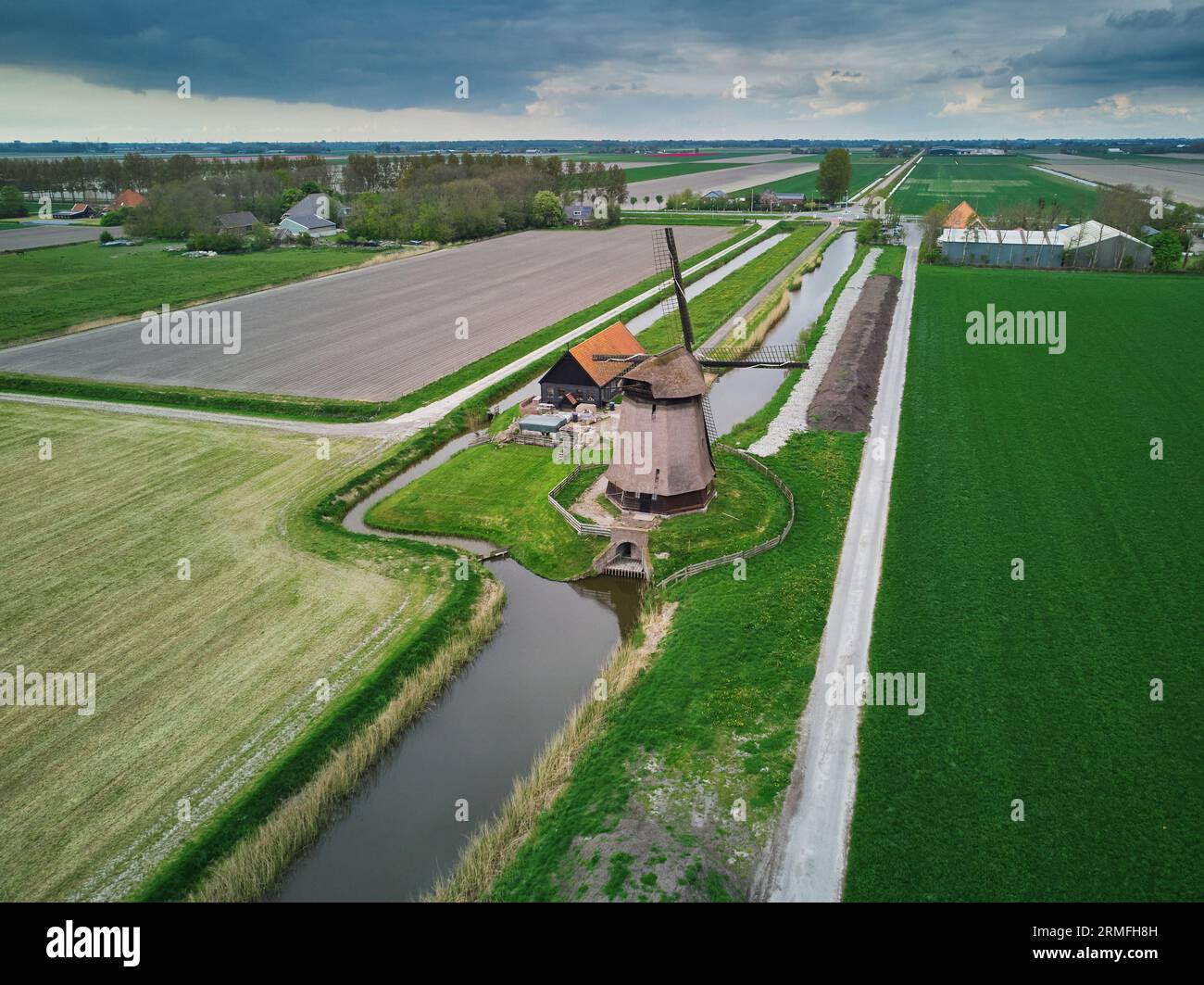 Aerial drone view of traditional Dutch windmill on the field. Typical ...