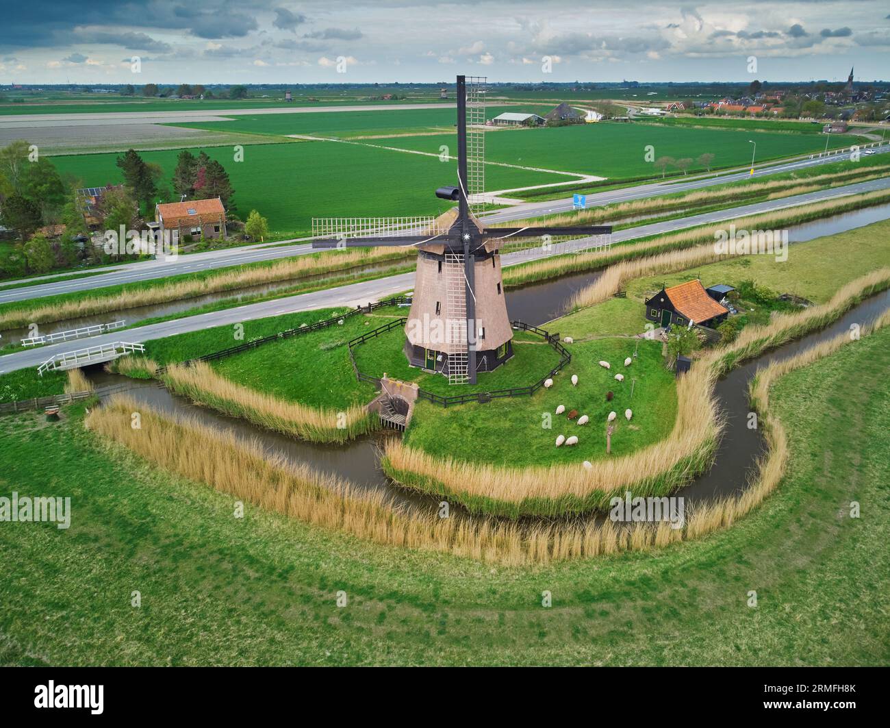 Aerial drone view of traditional Dutch windmill on the field. Typical ...