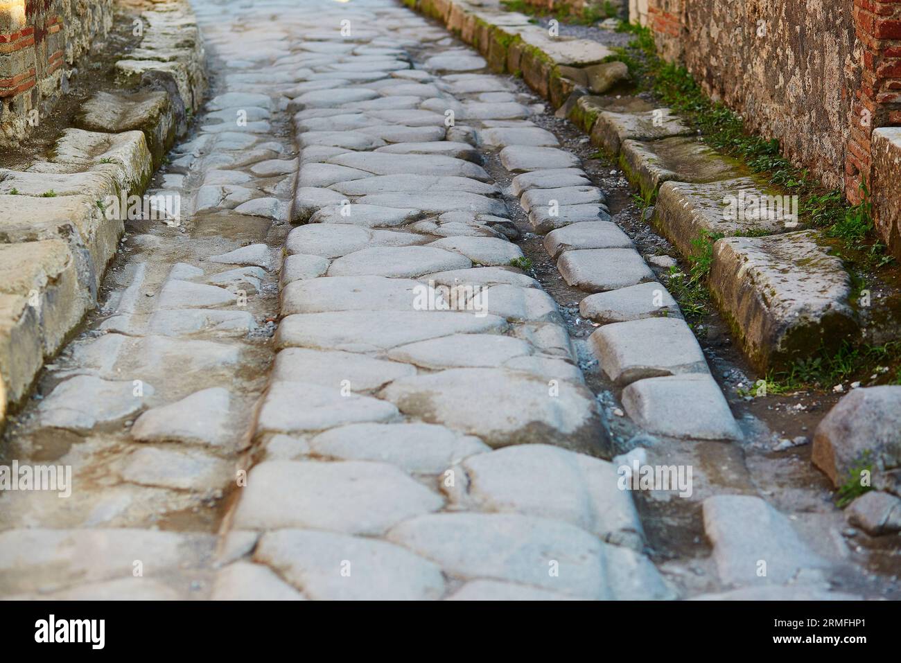 Ancient wheel track in Pompeii, Roman town near modern Naples destroyed ...