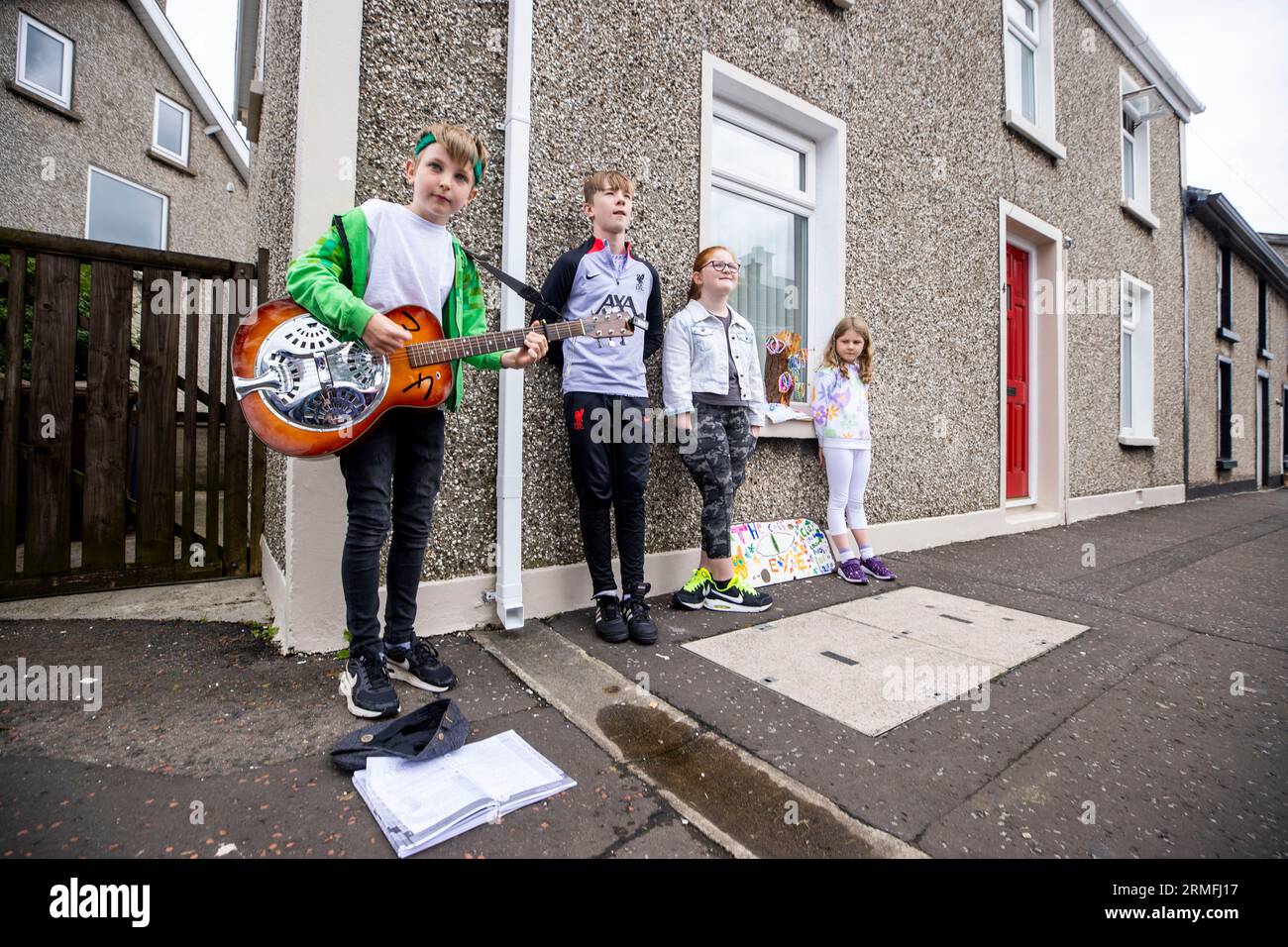 (left to right) Rory McKeown busking with his cousin Oliver Henry as ...