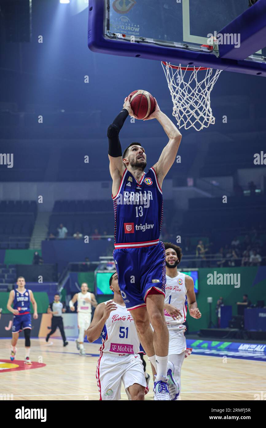 Manila, Philippines. 28th Aug, 2023. Serbia's Ognjen Dobric dunks ...