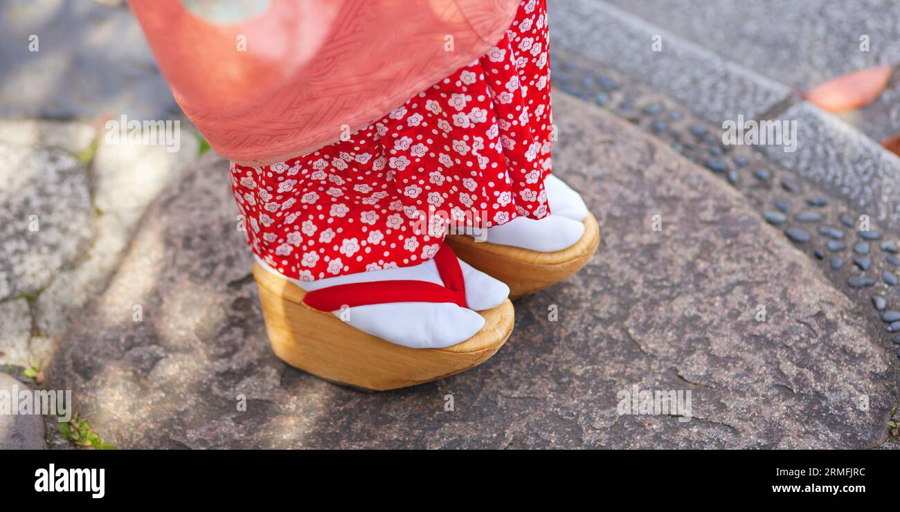 Maiko on traditional tabi and geta in Japan Stock Photo - Alamy