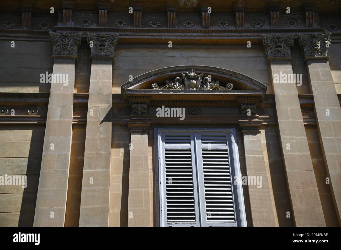 Old Neoclassical style building facade with Corinthian order pilasters in Ragusa Superiore ...